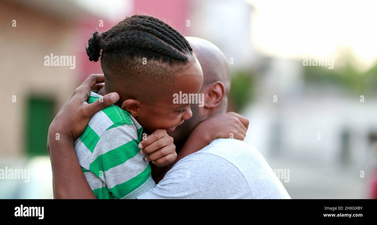 Father and son love care and affection. African dad cuddling with child ...