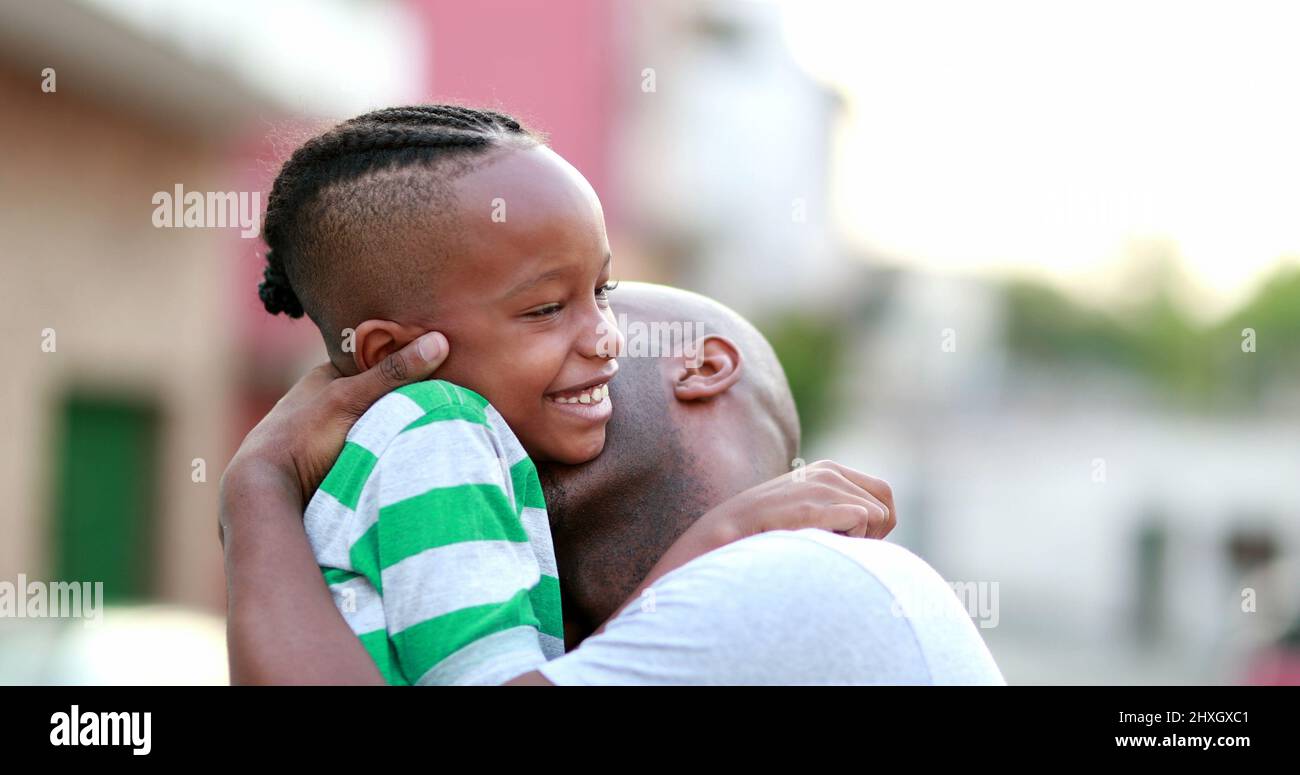 Father and son love care and affection. African dad cuddling with child ...