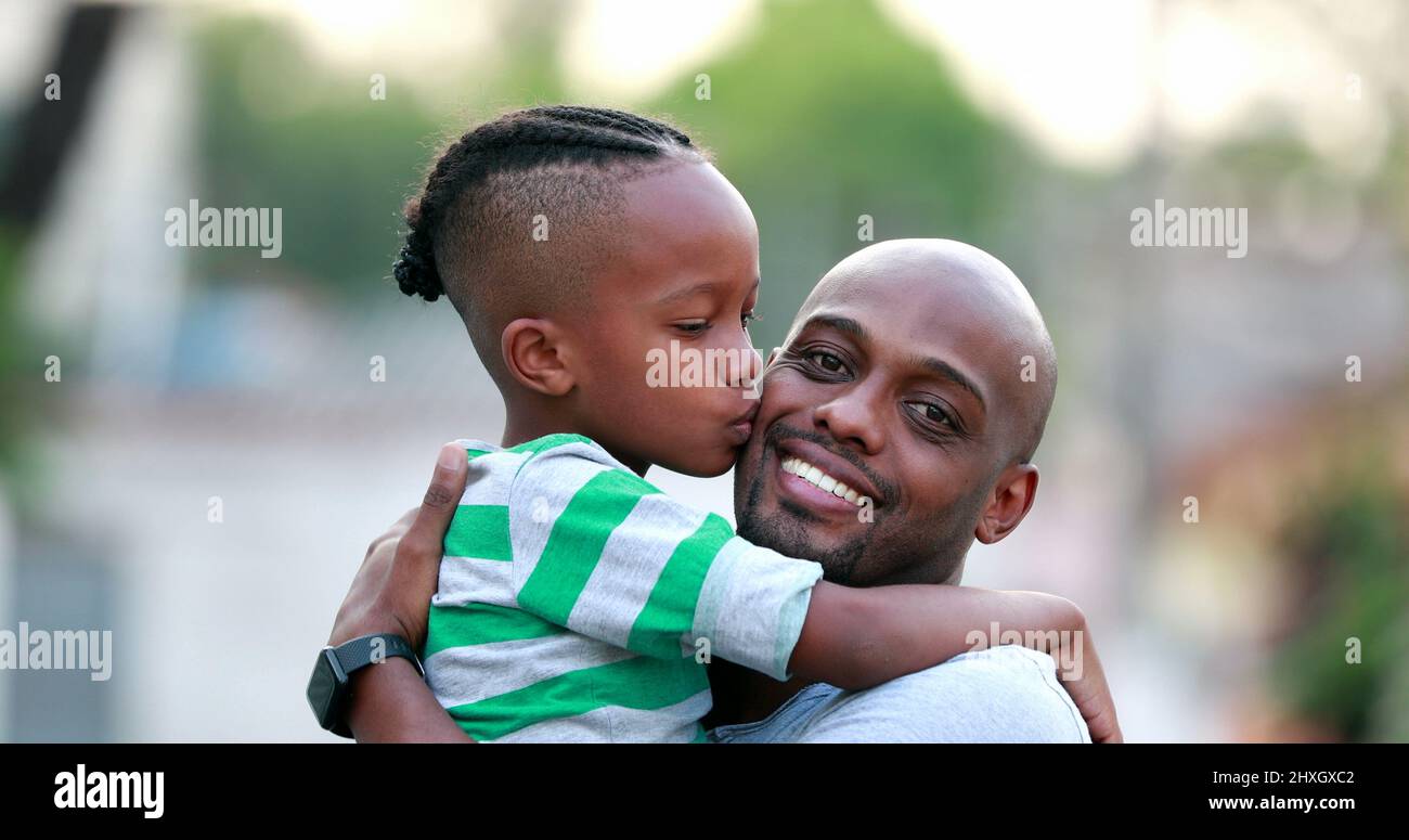 Father and son love and affection. Black African ethnicity. Dad and kid ...