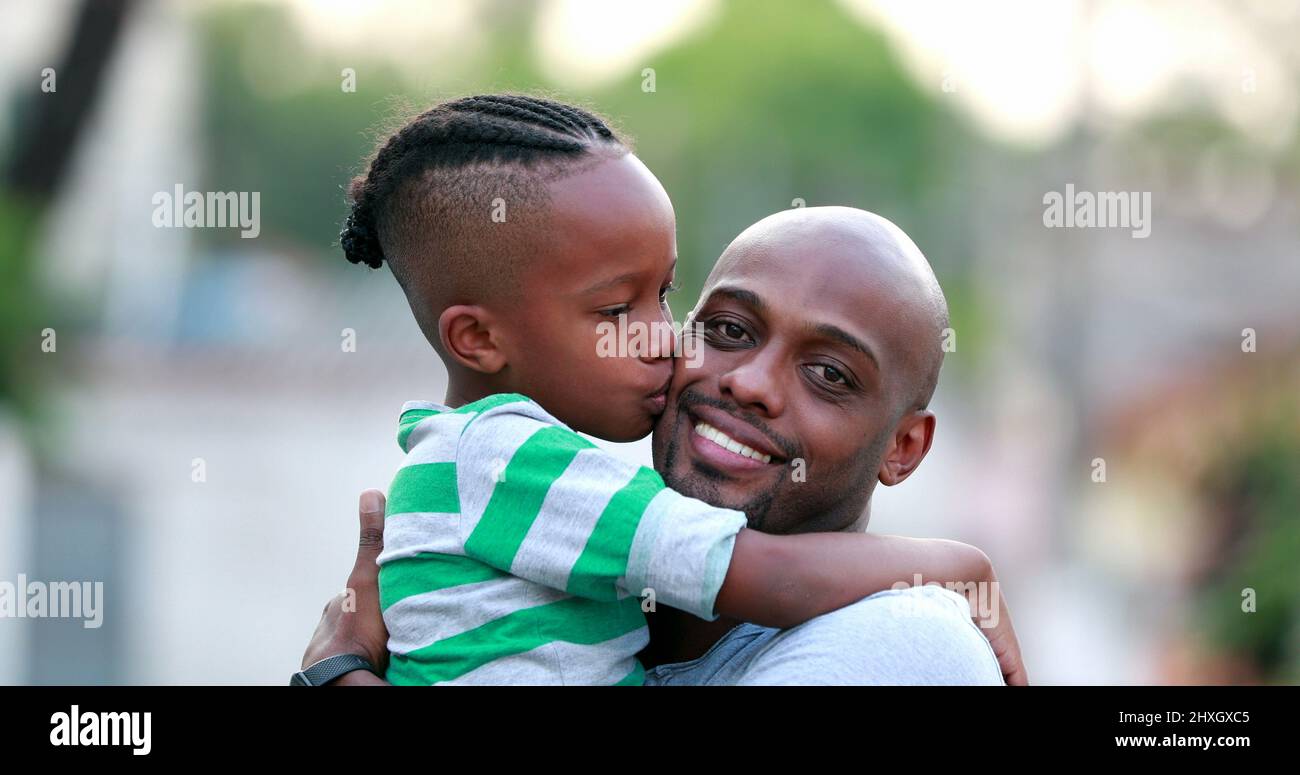 Father and son love and affection. Black African ethnicity. Dad and kid ...