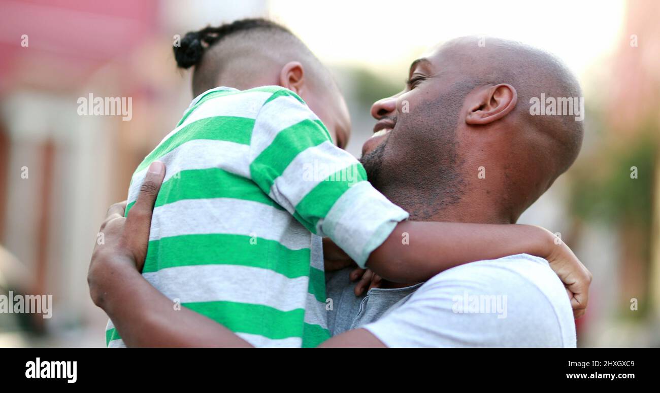 Father and son love care and affection. African dad cuddling with child ...