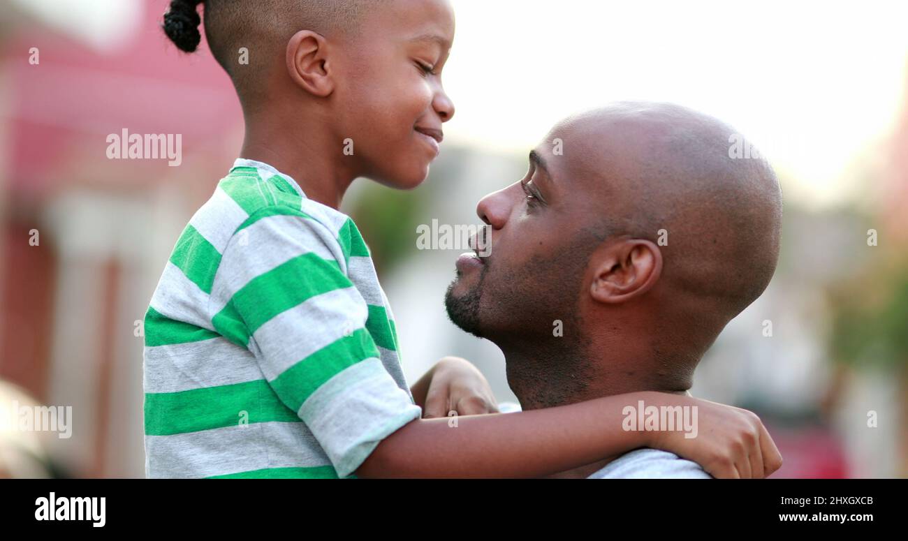 Father and son love care and affection. African dad cuddling with child ...