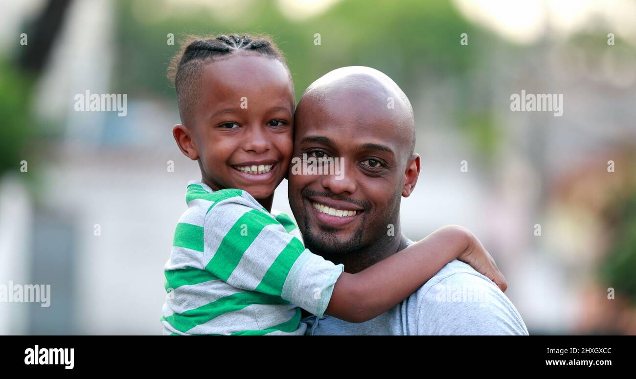 Father and son love and affection. Black African ethnicity. Dad and kid ...