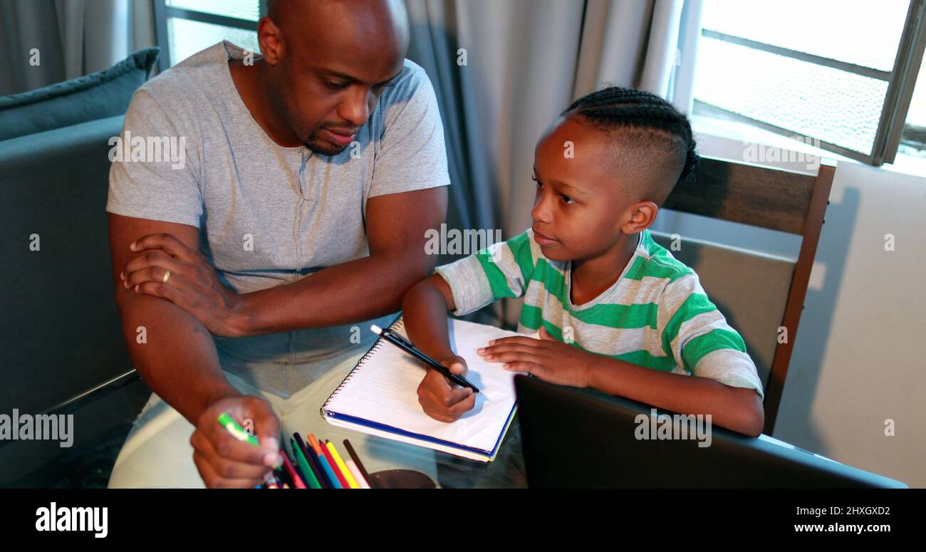 Black dad son homework hi-res stock photography and images - Alamy