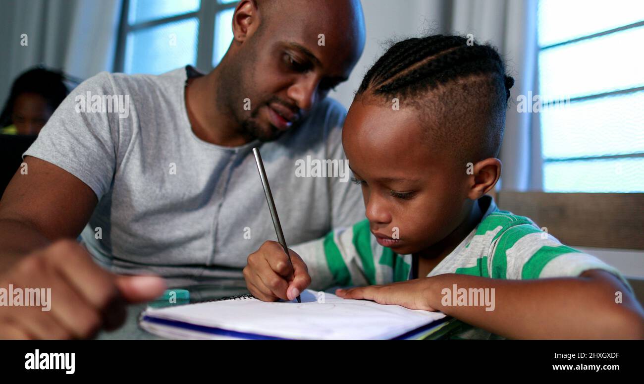 Black dad son homework hi-res stock photography and images - Alamy