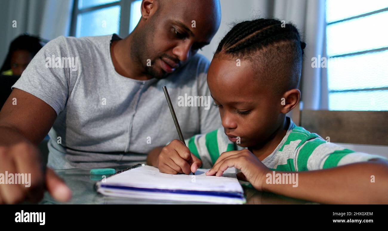 Father mentoring son, dad helping kid with homework study Stock Photo ...