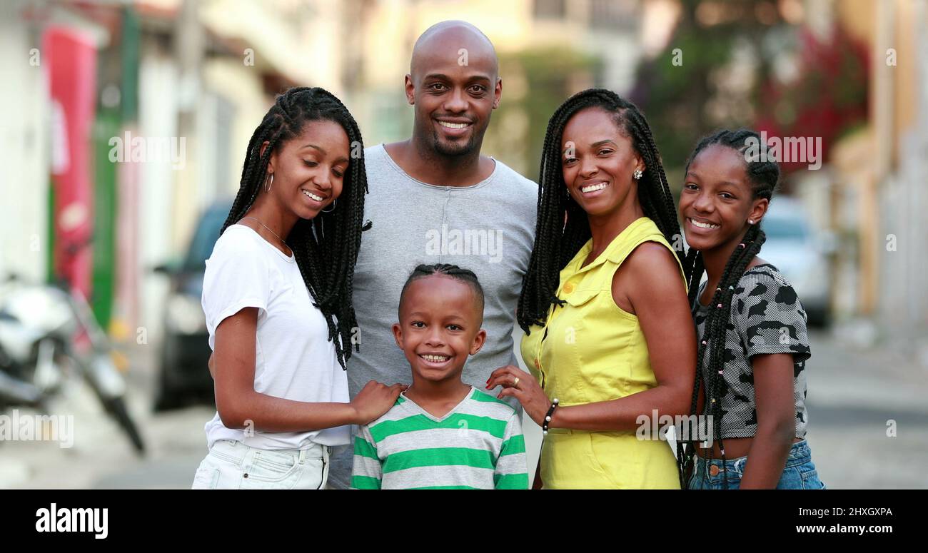 Happy African family portrait standing for photo outside. Cheerful ...