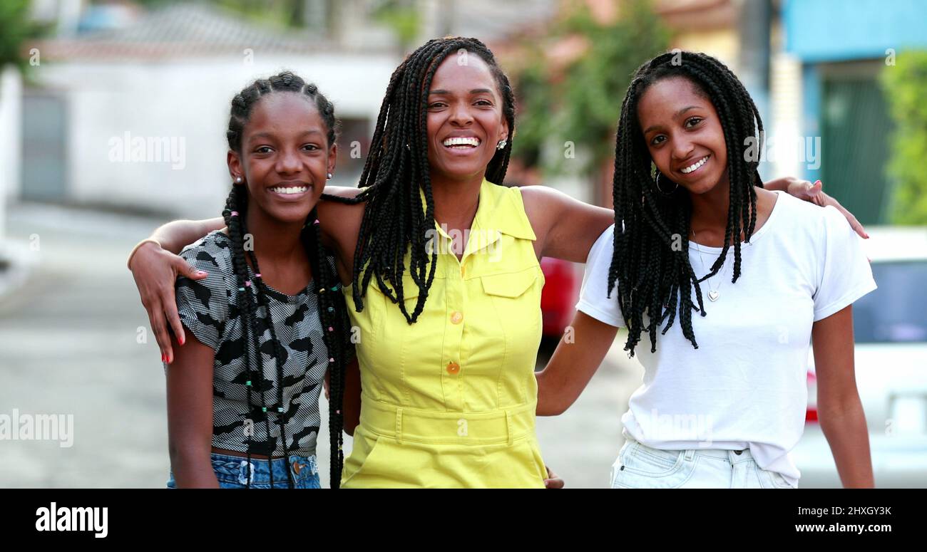 Mother and children making heart symbol with hands. African black mom ...