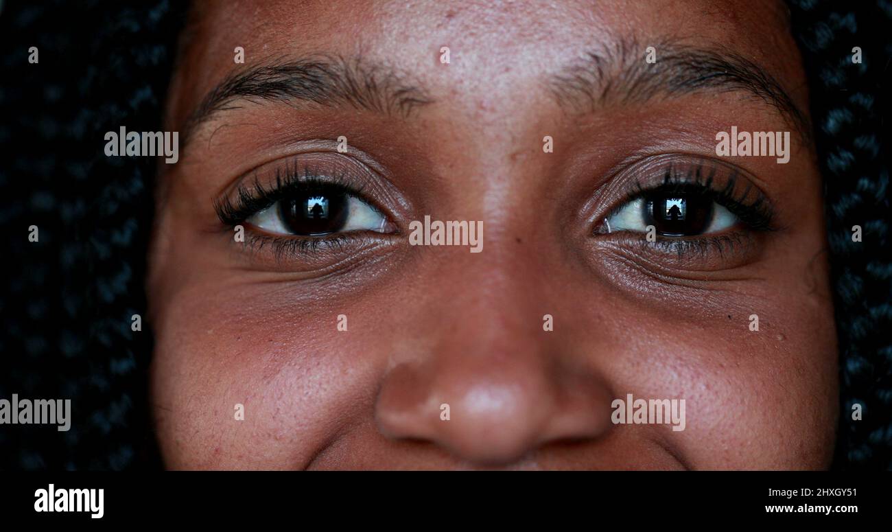 Smiling happy black African american young woman eyes face looking at ...