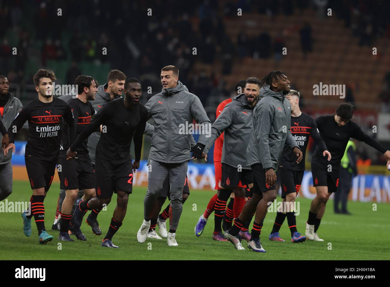 Players of AC Milan celebrate the victory at the end of the match ...