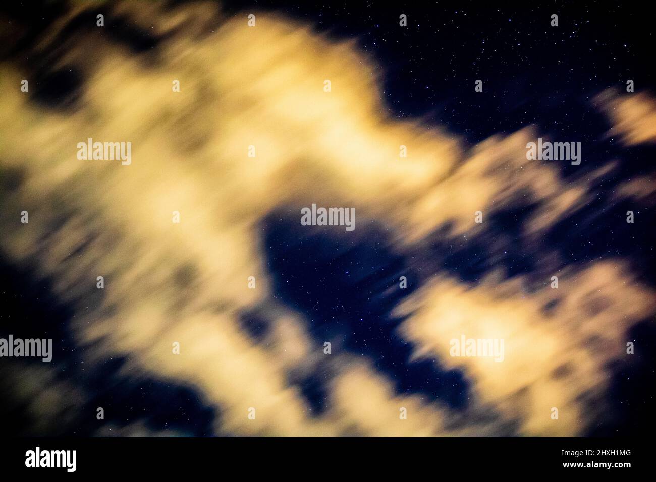 Stars in space, real photography with moving clouds Stock Photo - Alamy