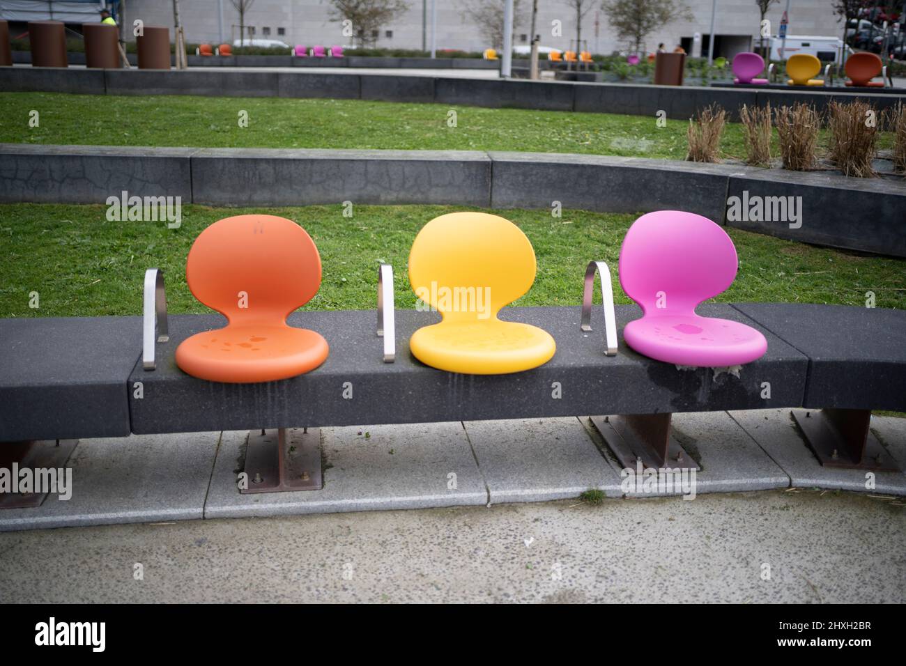 Close-up of three chairs on the walkway in the street Stock Photo - Alamy