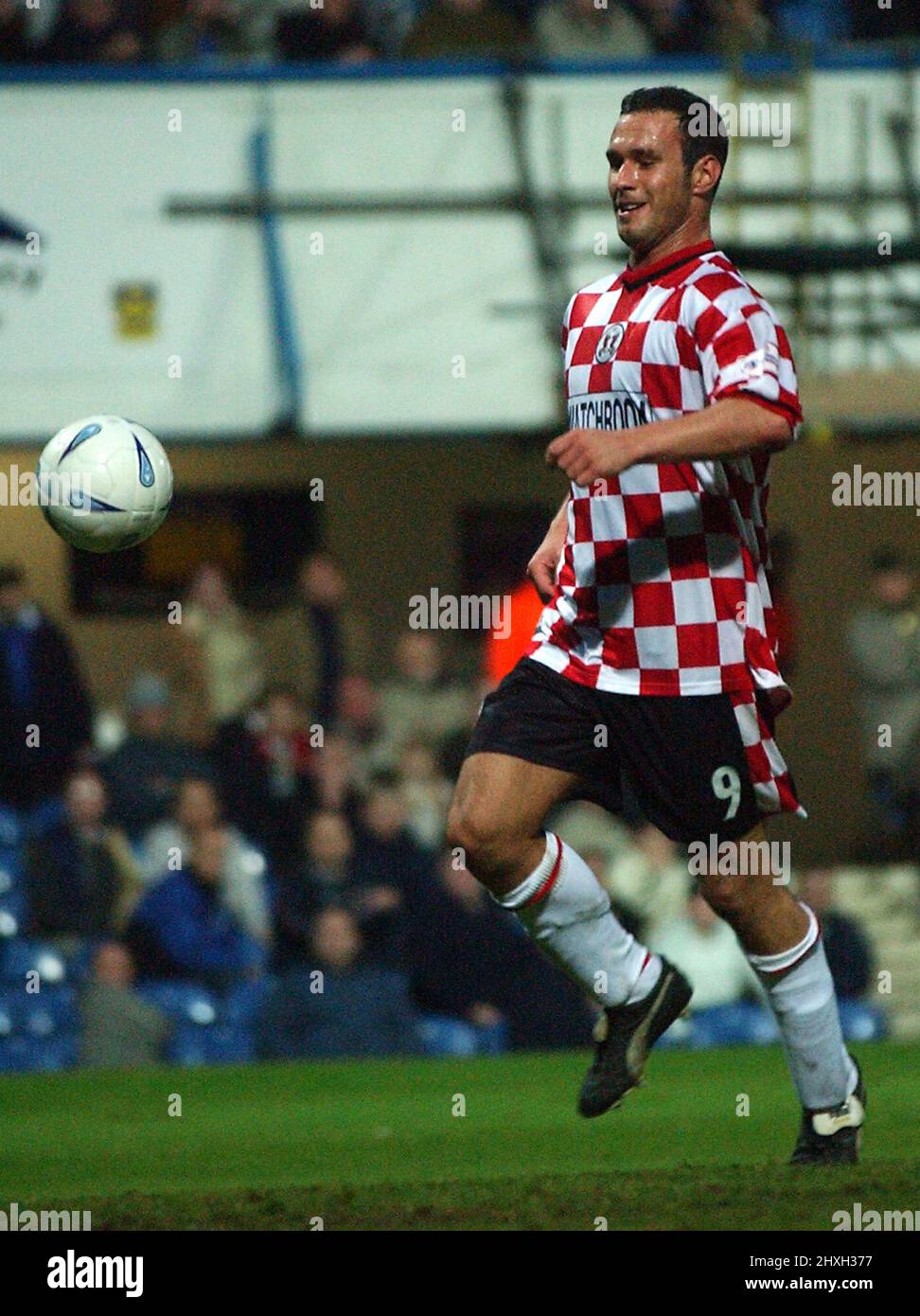PORTSMOUTH V ORIENT. ORIENTS STEVE WATTS SMILES AS HE PUTS THE BALL ...