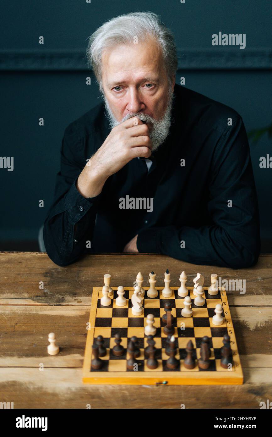 Old man playing chess alone hi-res stock photography and images - Alamy