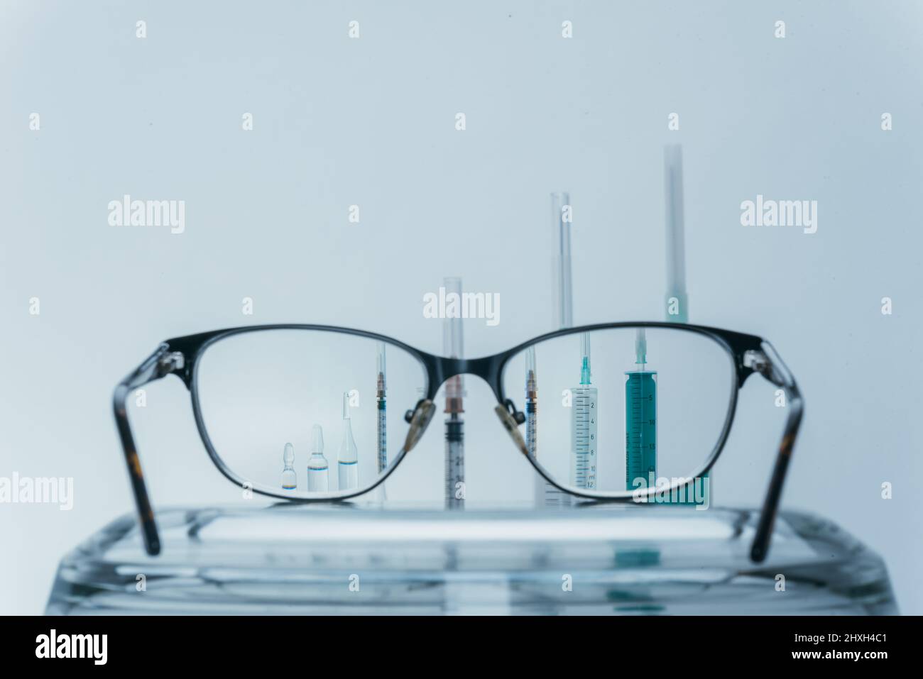 View in glasses. Medicine, Injection, vaccine and disposable syringe ...