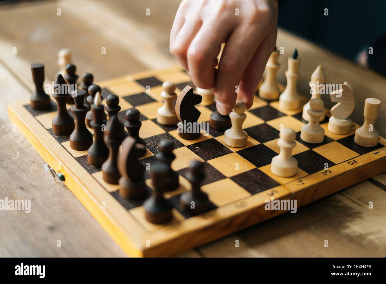 Close-up high-angle view of unrecognizable chess player performing move ...