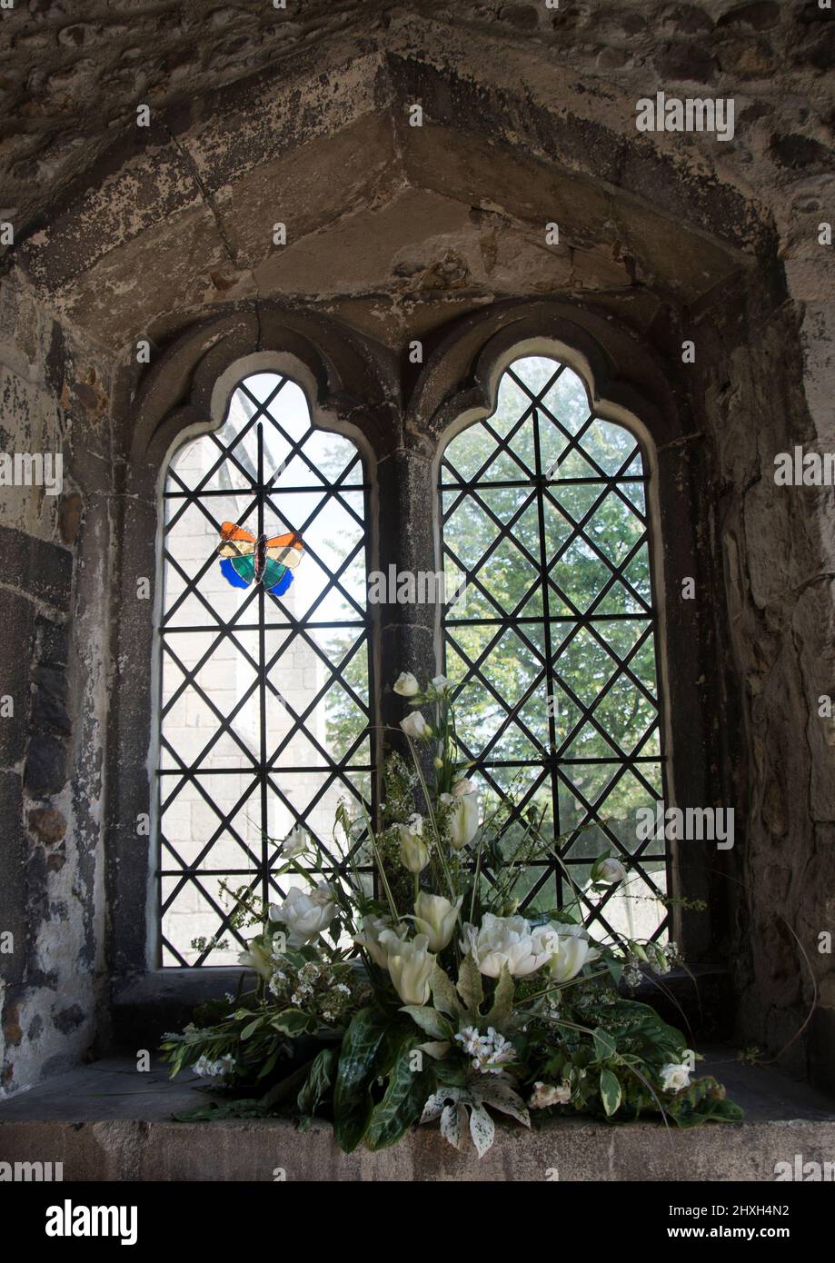 A church window and Easter flower arrangement suitable for a card Stock ...