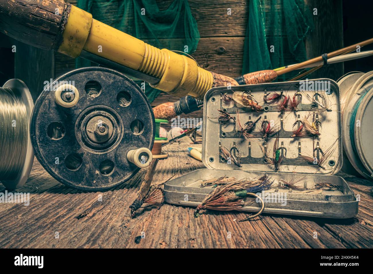 Old and restro fisherman equipment. Angler equipment with floats, rods ...