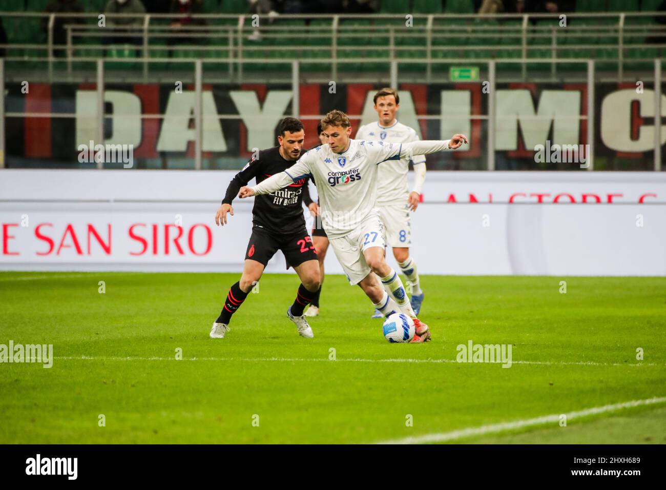 Szymon Zurkowski contrast the balll with Alessandro Florenzi of AC ...