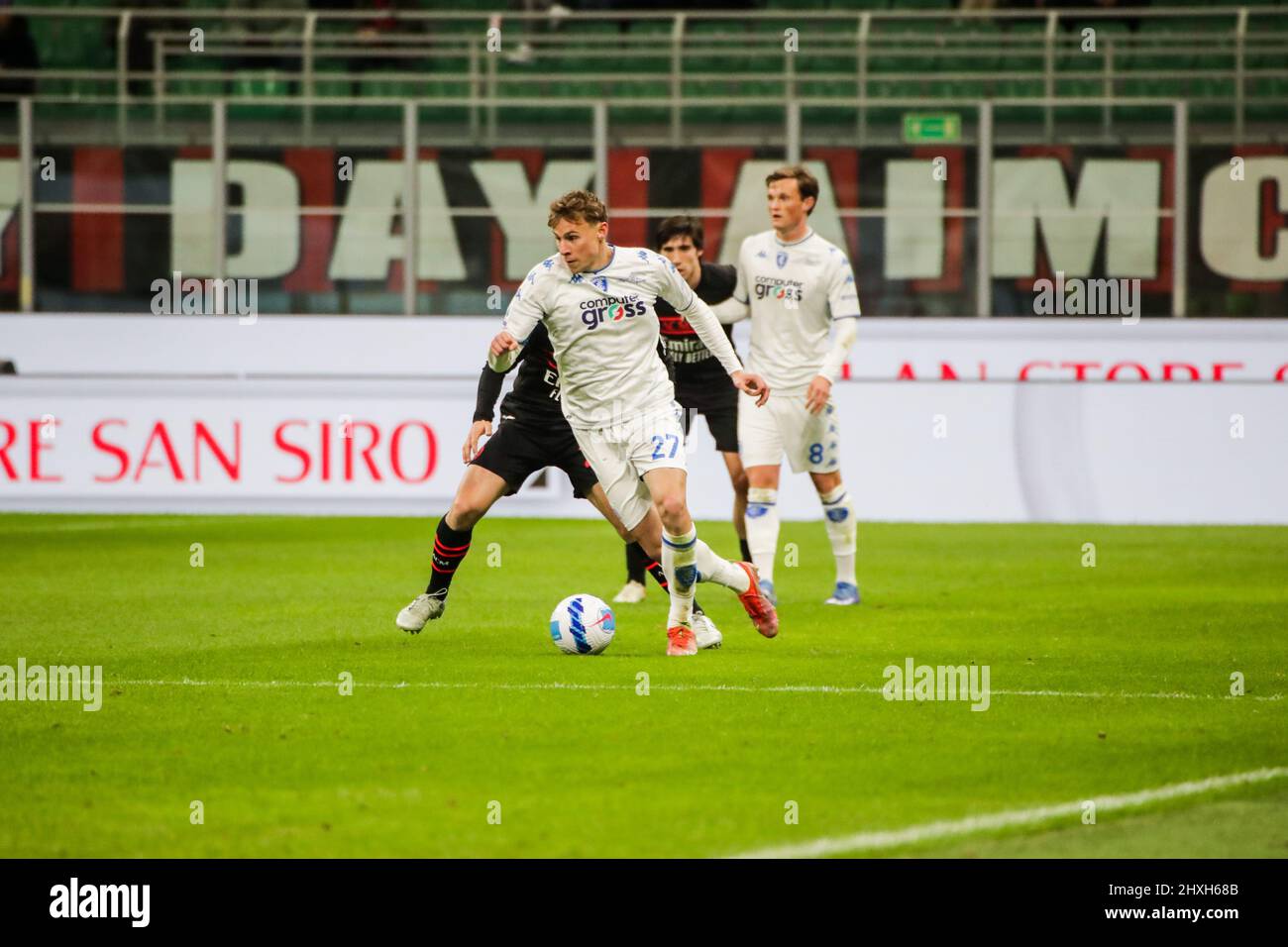 Szymon Zurkowski contrast the balll with Alessandro Florenzi of AC ...