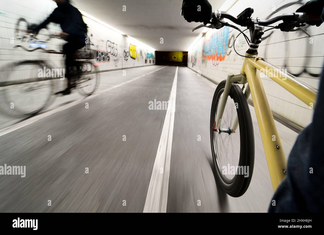 Cyclists bicycling on underpass bike cycle bicycle way lane track at ...