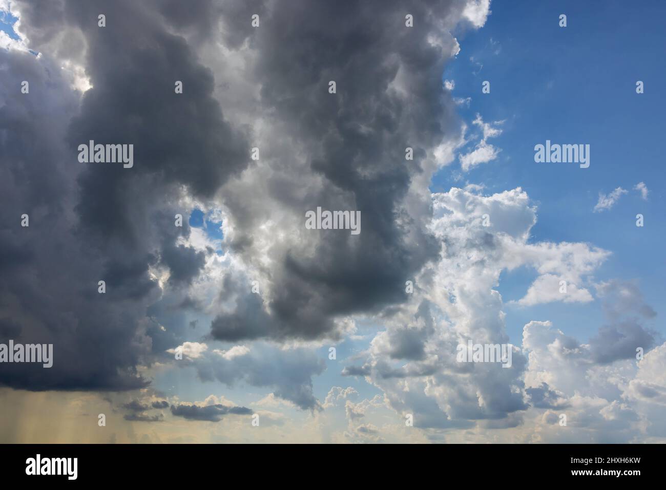 White fluffy cumulus clouds flying, blue sky at fast moving cloud Stock ...