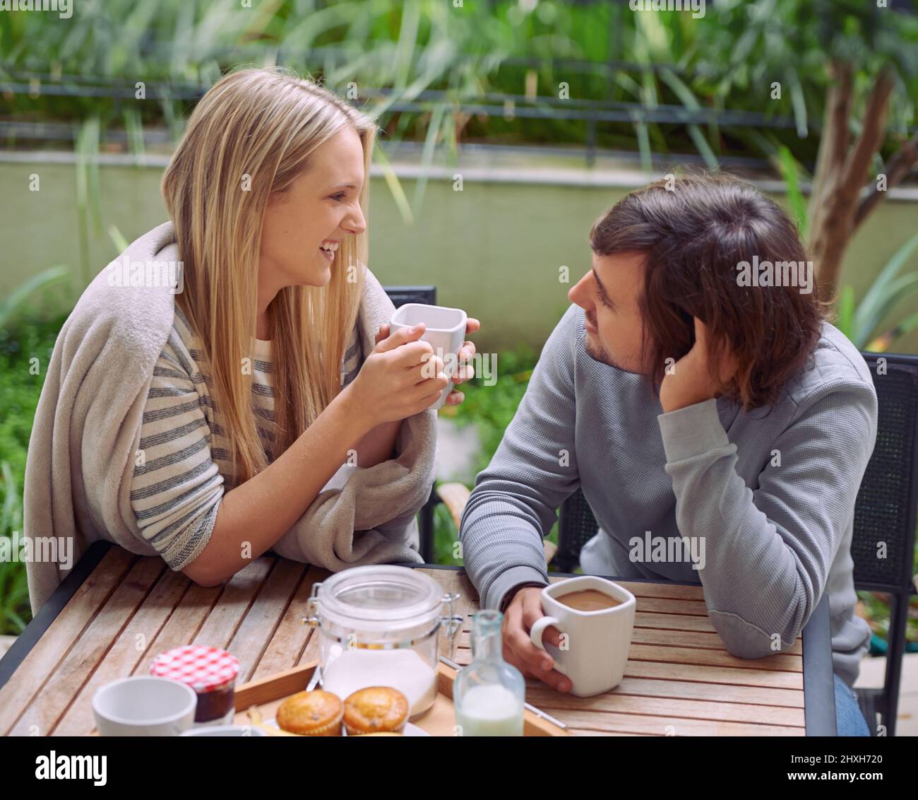 Love is friendship on fire. A happy young couple having coffee together ...