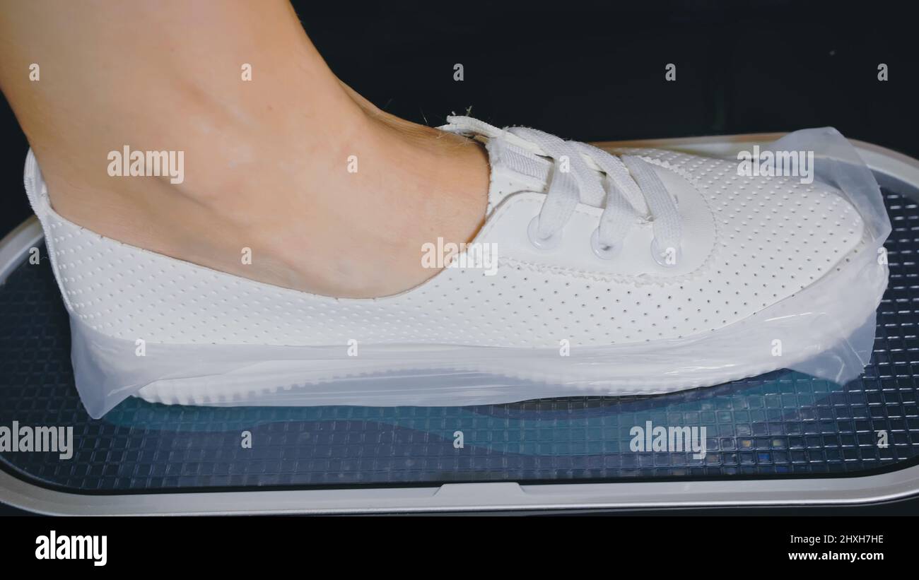 Automatic Thermal Shrinkable Shoe Cover Laminating Machine. Close up ...
