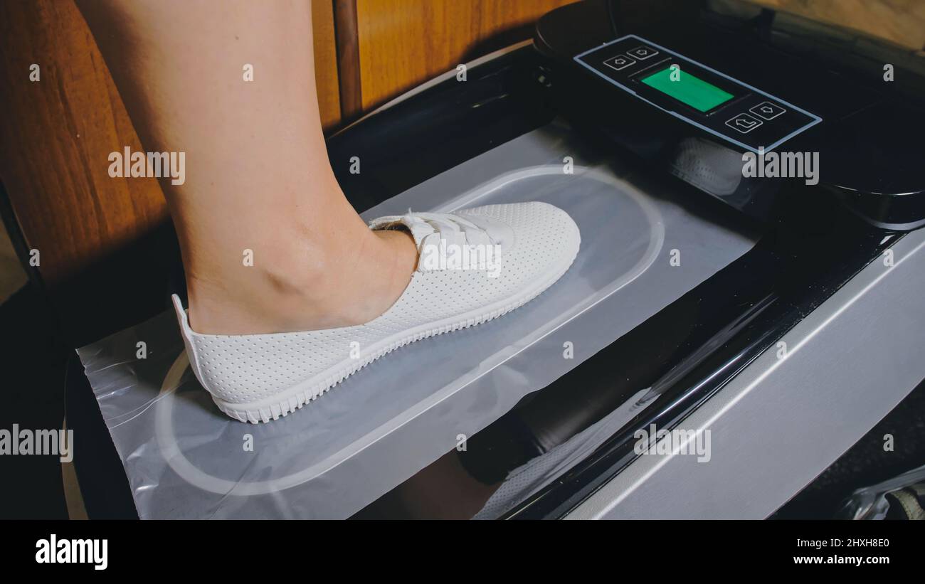 Automatic Thermal Shrinkable Shoe Cover Laminating Machine. Close up ...