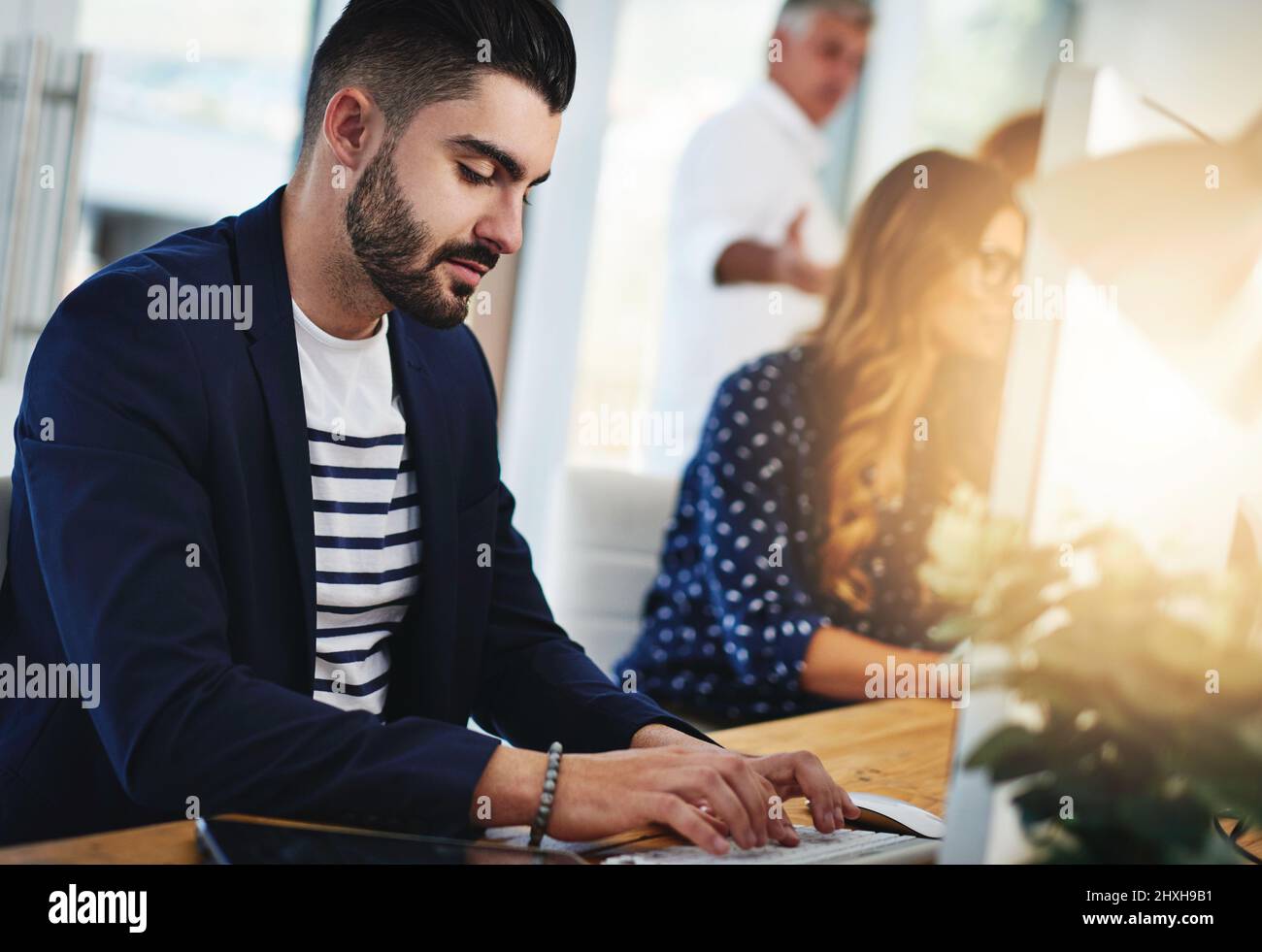 Tackling big problems. Cropped shot of a young designer working at his ...