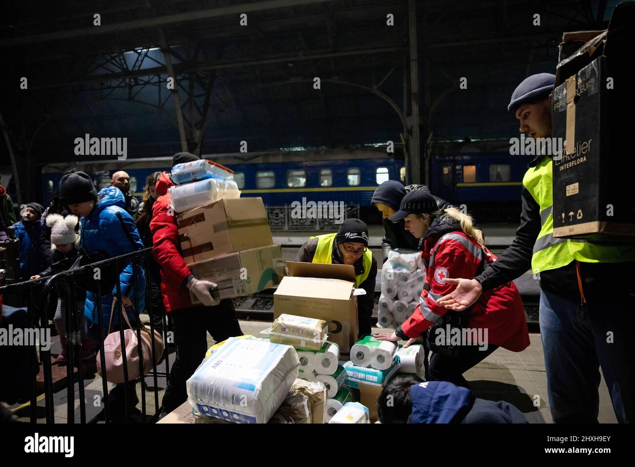 Lviv, Ukraine. 12th Mar, 2022. Volunteers are moving toilet rolls and ...