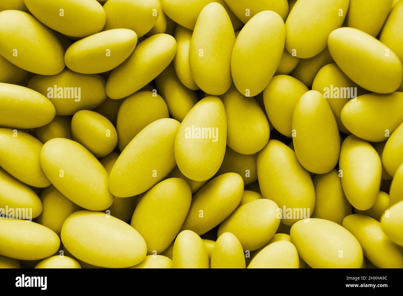 Confetto chocolate , almond candies, yellow almond sweets Stock Photo ...