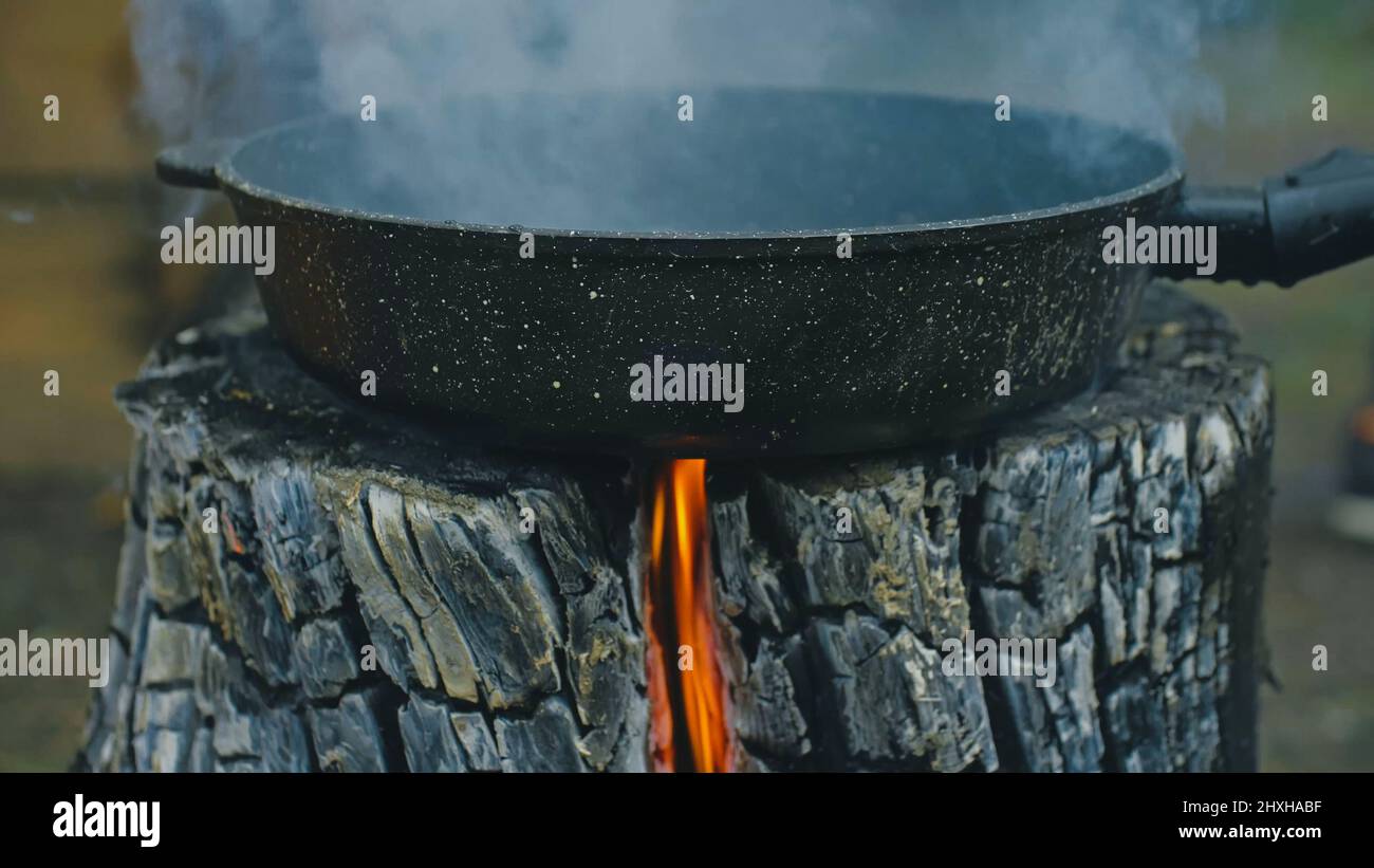Swedish or finnish log candle. Fire burning from inside the wooden log ...