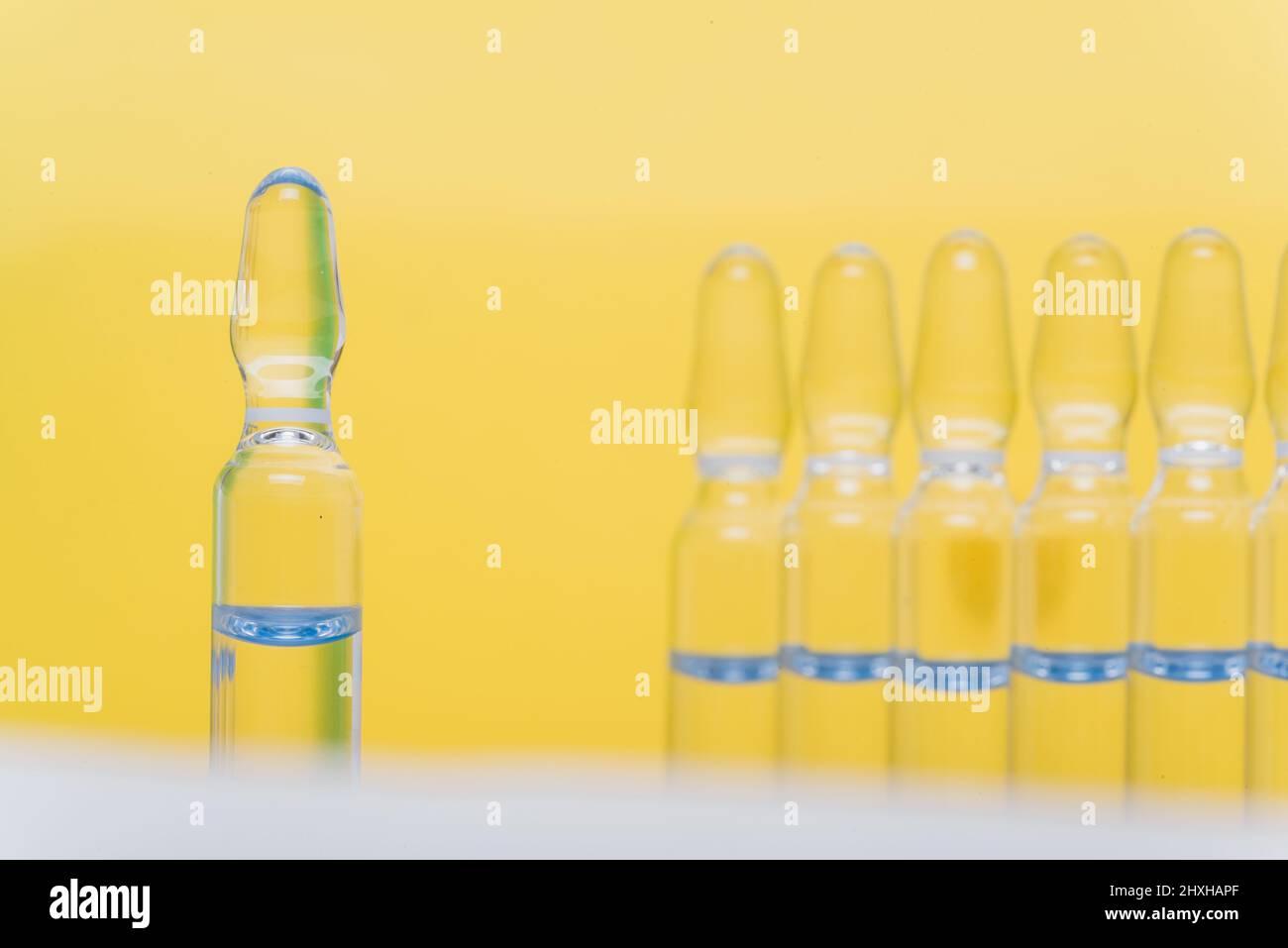 Glass medical ampoule vial for injection. Medicine is liquid sodium ...