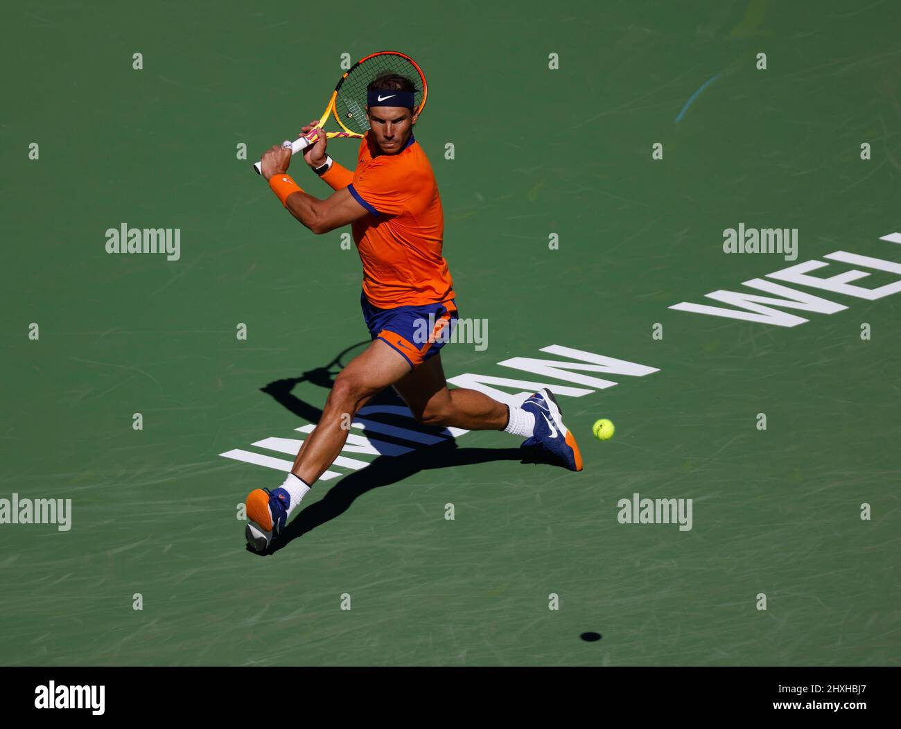 March 12, 2022 Rafael Nadal of Spain returns a shot against Sebastian ...