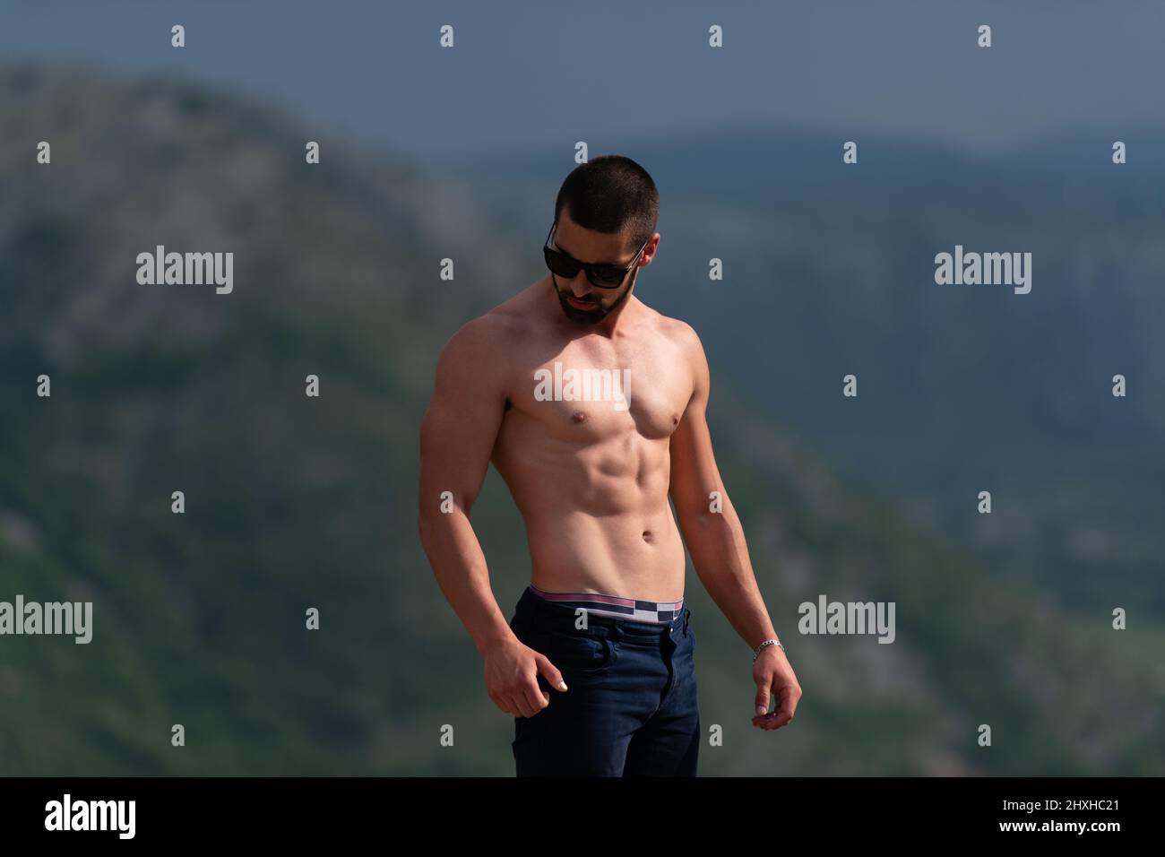 Handsome Beard Man Standing Strong and Posing Outdoors - Mountain ...
