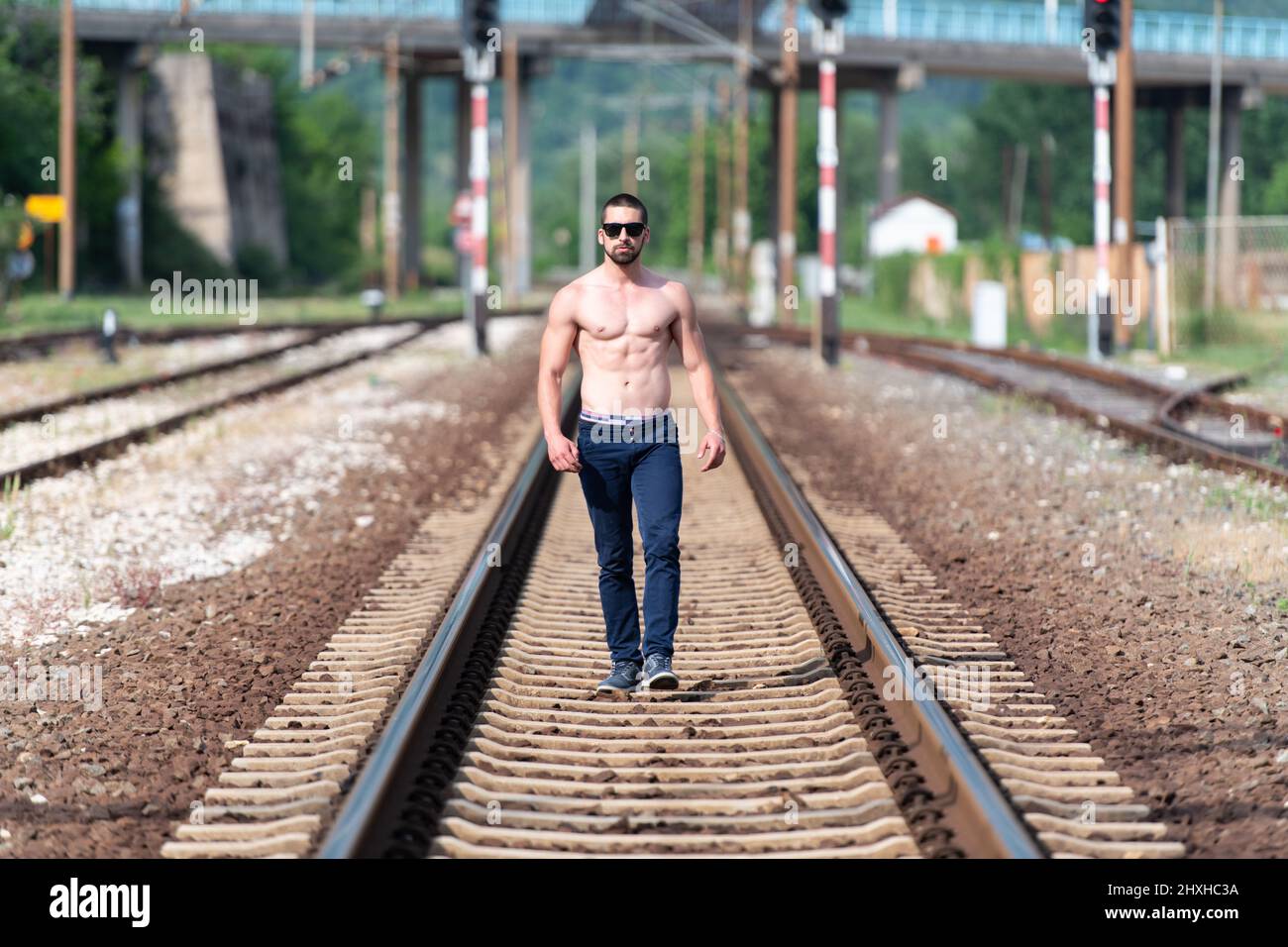 Handsome Beard Man Standing Strong and Posing Outdoors at Railroad From ...