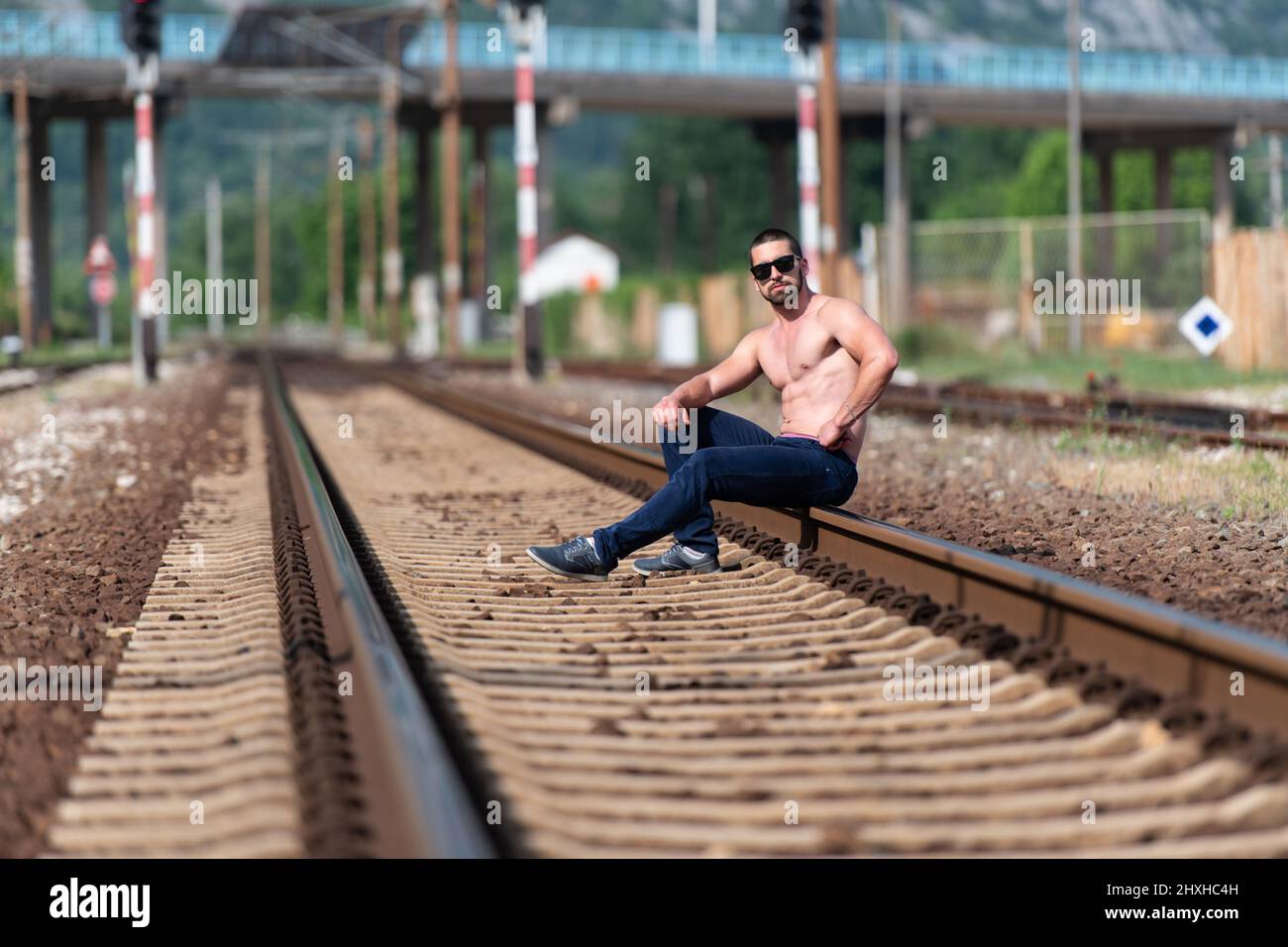 Handsome Beard Man Resting After Posing at Outdoors at Railroad From ...