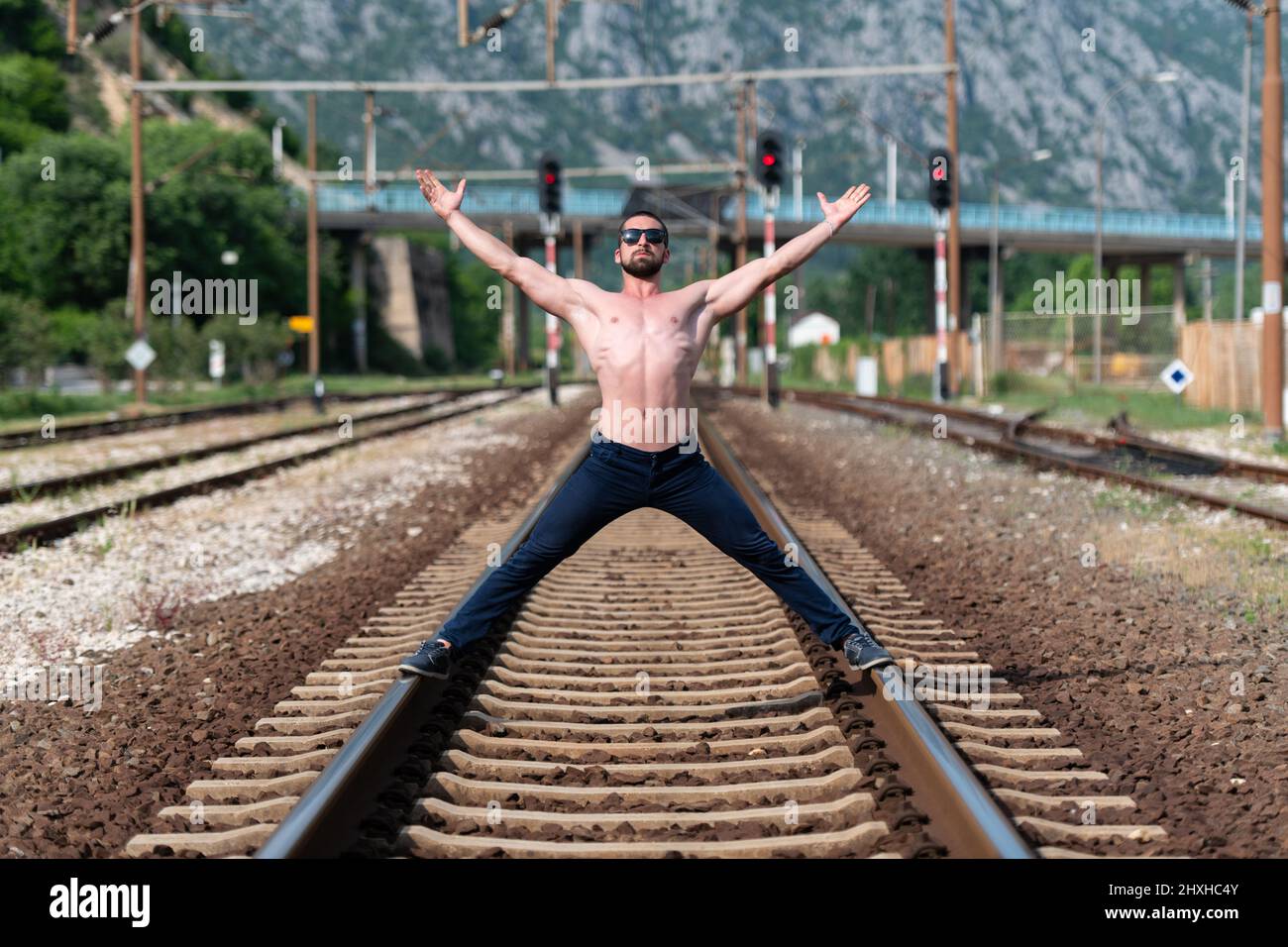 Handsome Beard Man Standing Strong and Posing Outdoors at Railroad From ...