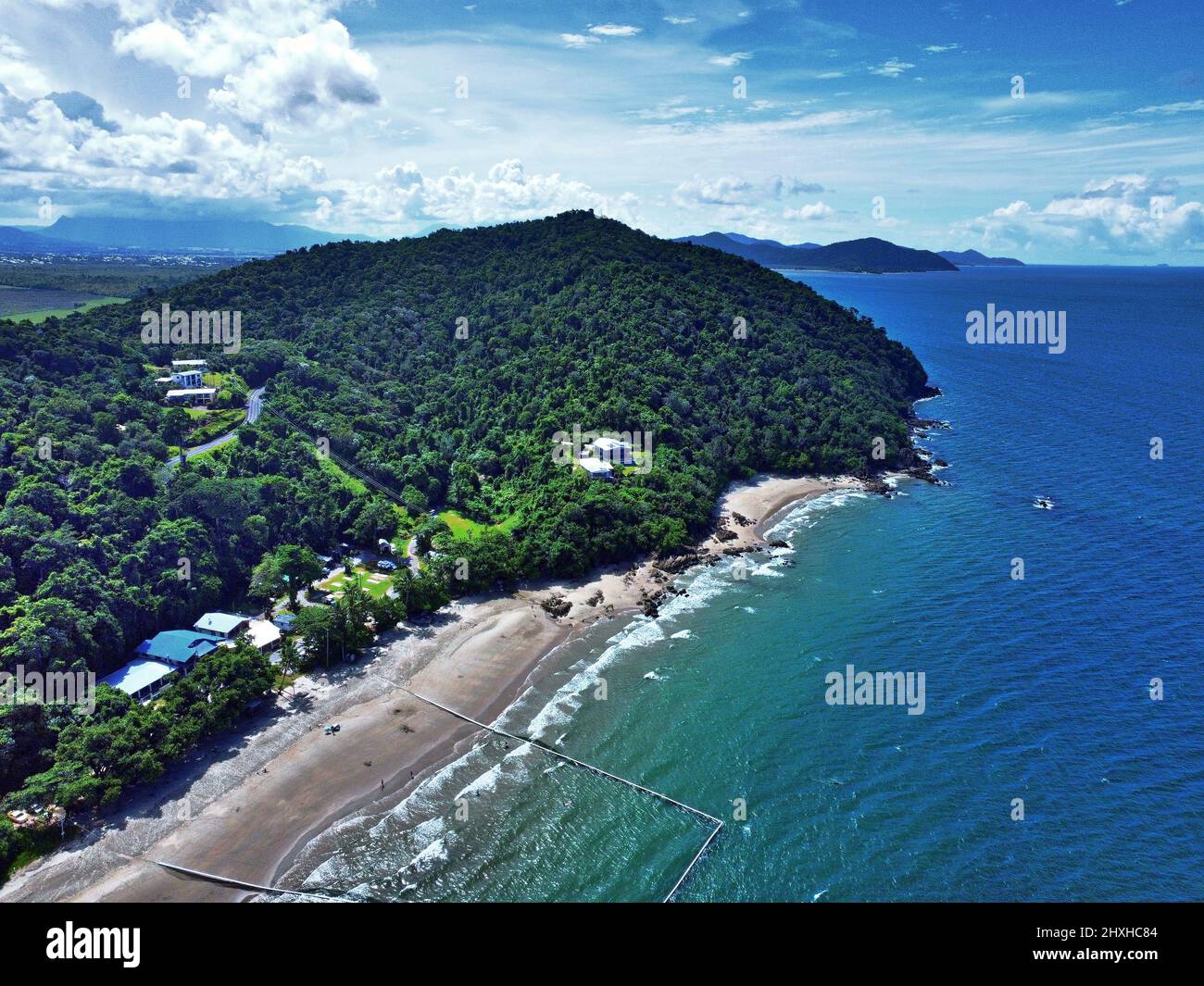 Aerial view of Etty bay with mountain backdrop Stock Photo - Alamy