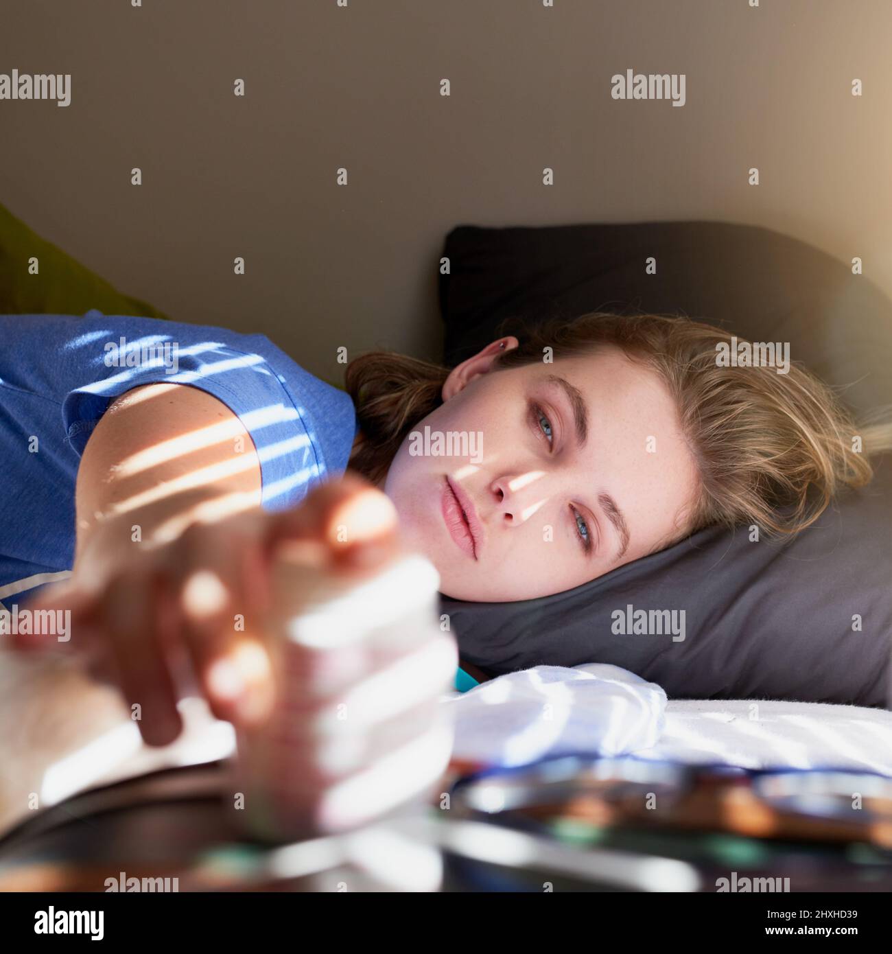Waking up and looking at an alarm clock hi-res stock photography and ...