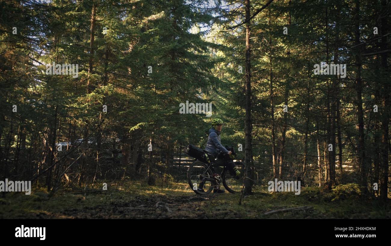 The woman travel on mixed terrain cycle touring with bike bikepacking ...