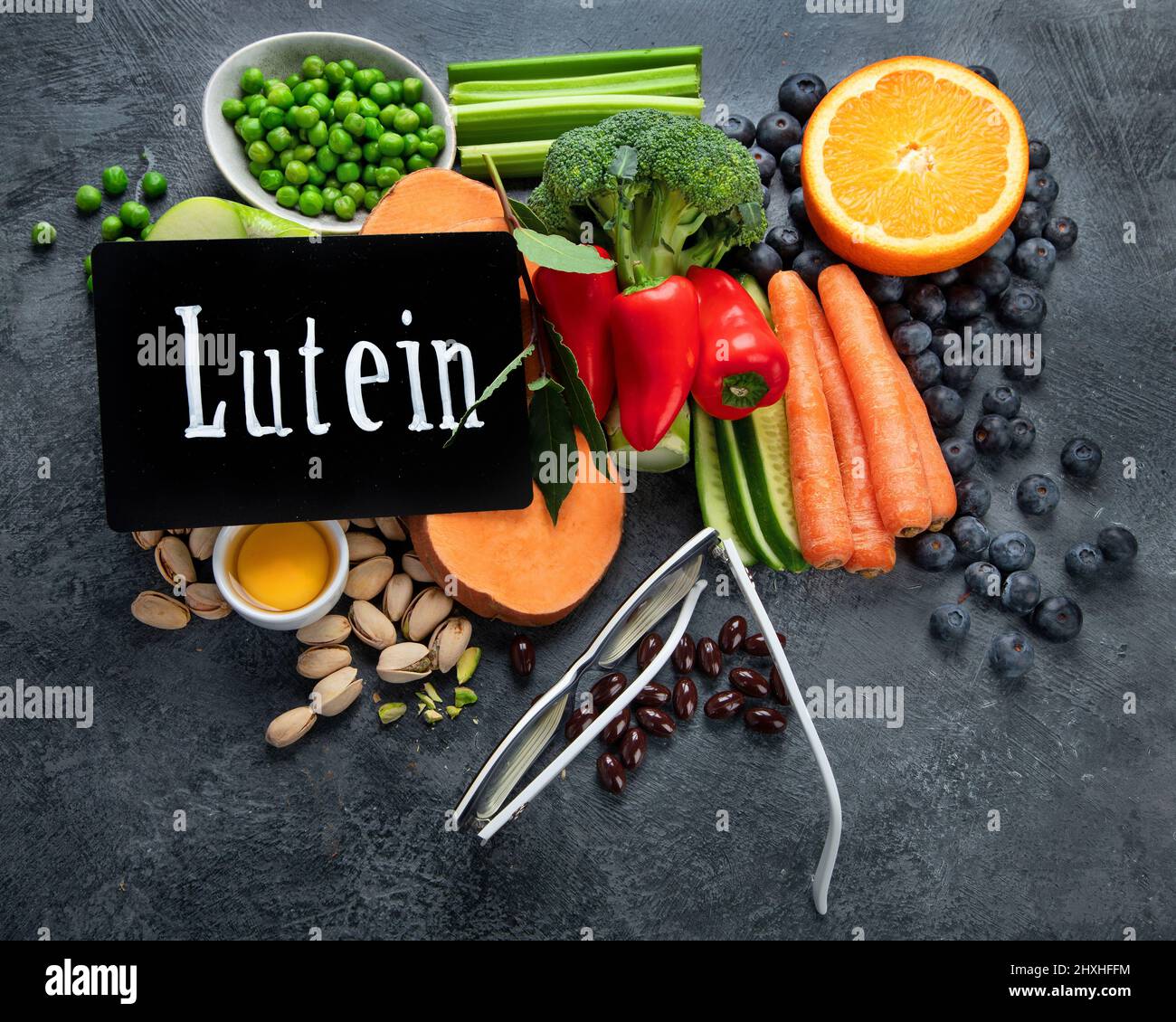 Foods high in lutein on dark background. Food for healthy eyes. High in ...