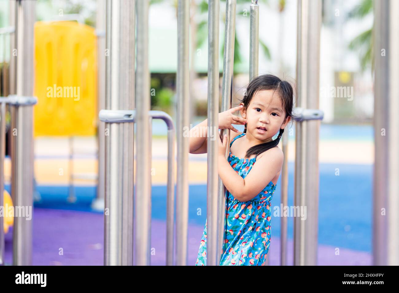 Asian child playing on outdoor playground, happy preschool little kid ...