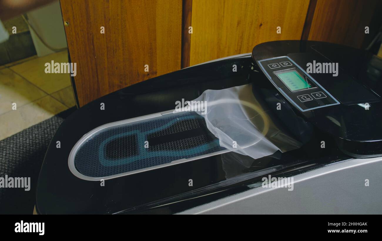 Automatic Thermal Shrinkable Shoe Cover Laminating Machine. Close up ...