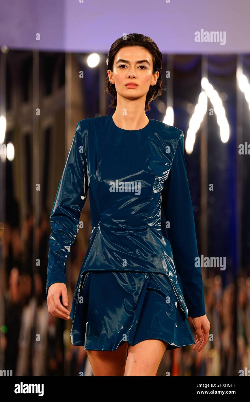 Lisbon, Portugal. 12th Mar, 2022. A model walks the runway during Luis ...