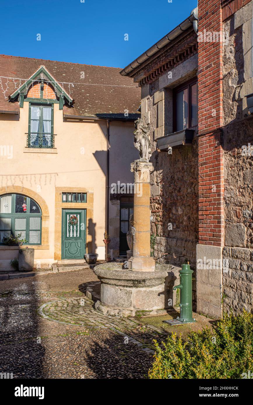 A sculpture on a fountain in the town of Bourbon-Lancy in Burgundy ...