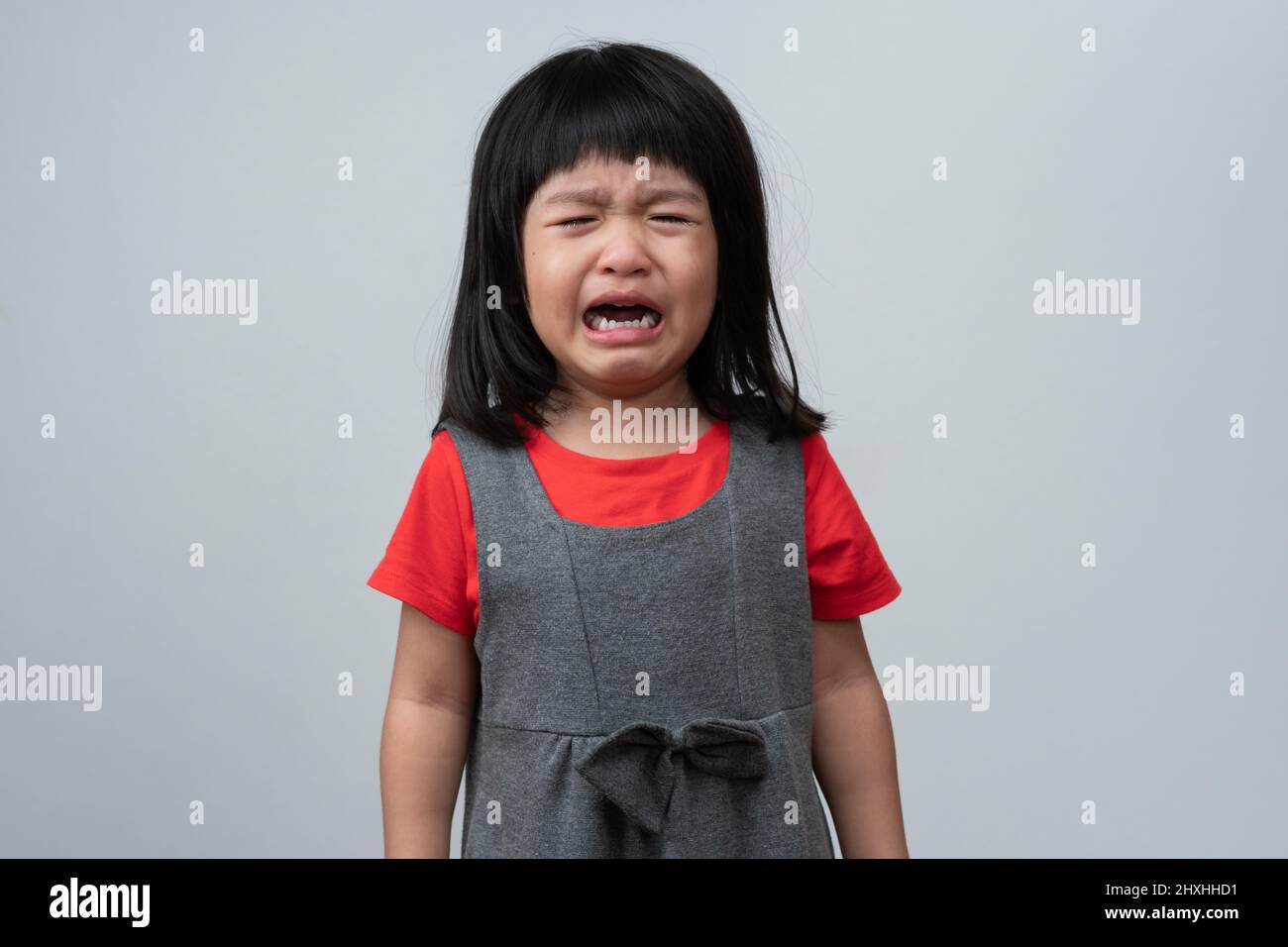 Portrait of Asian angry, sad and cry little girl on white isolated ...