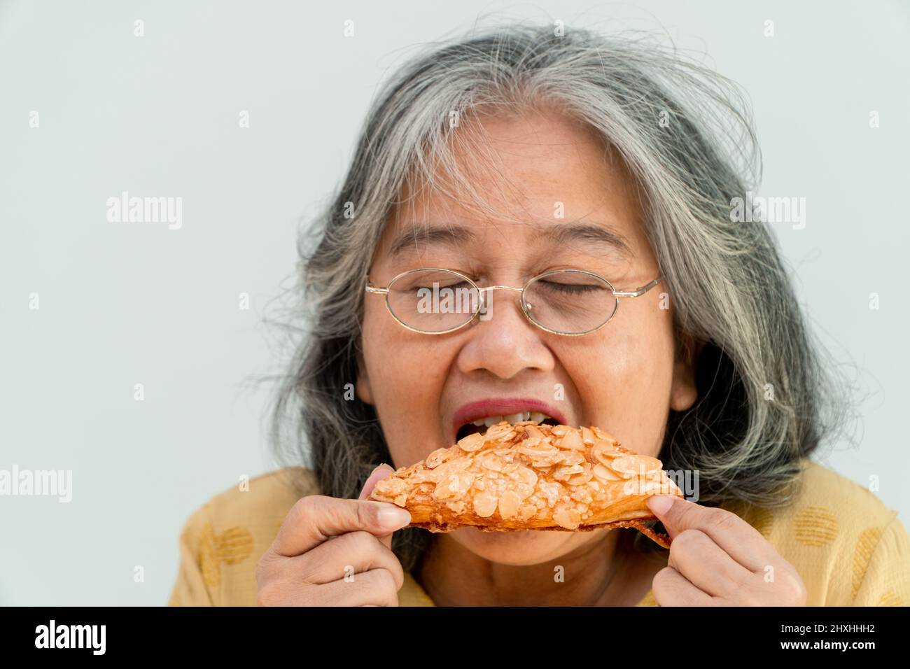 Happy Asian senior women enjoying eating pie Stock Photo - Alamy