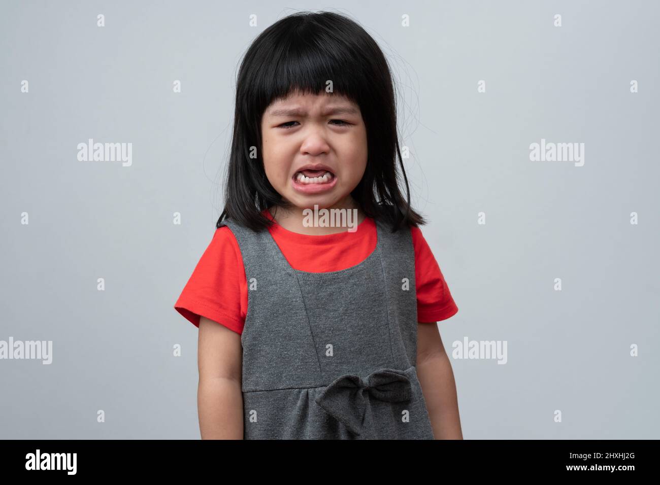 Portrait of Asian angry, sad and cry little girl on white isolated ...